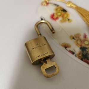 Louis Vuitton | Accessories | Louis Vuitton Lv Lock And Key Combination ...
